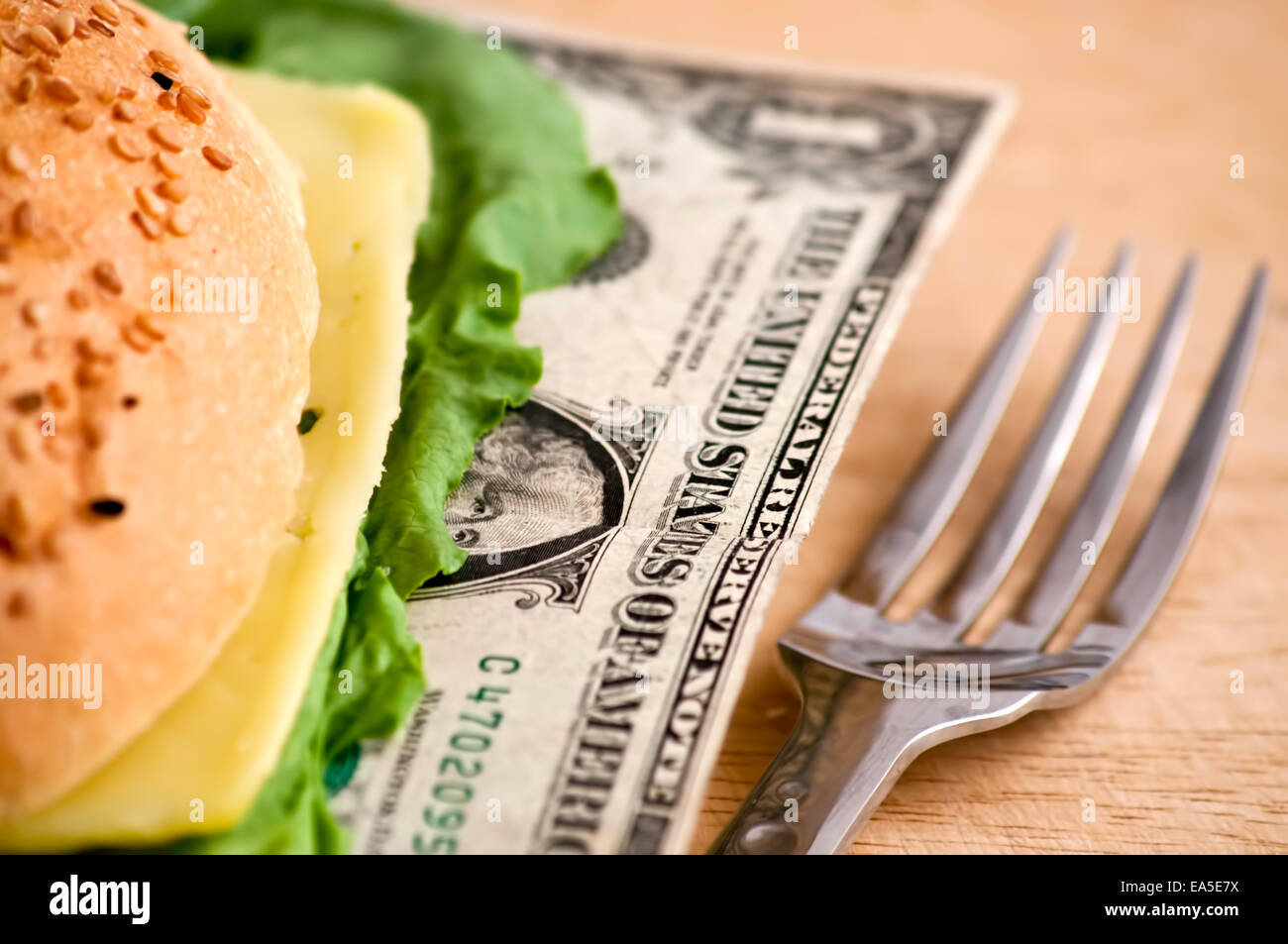 US dollars in a hamburger bun, close-up Stock Photo - Alamy