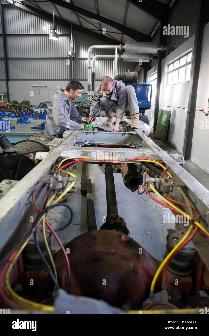 Two diesel mechanics at work Stock Photo - Alamy