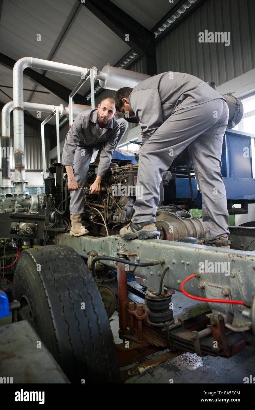 Two diesel mechanics at work Stock Photo - Alamy