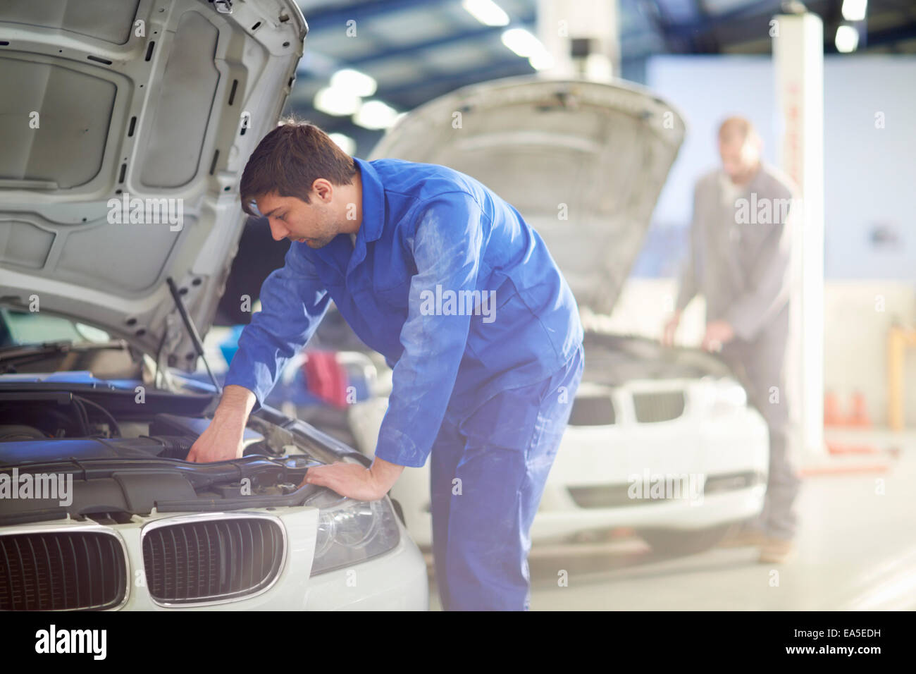 Car mechanic at work in repair garage Stock Photo - Alamy