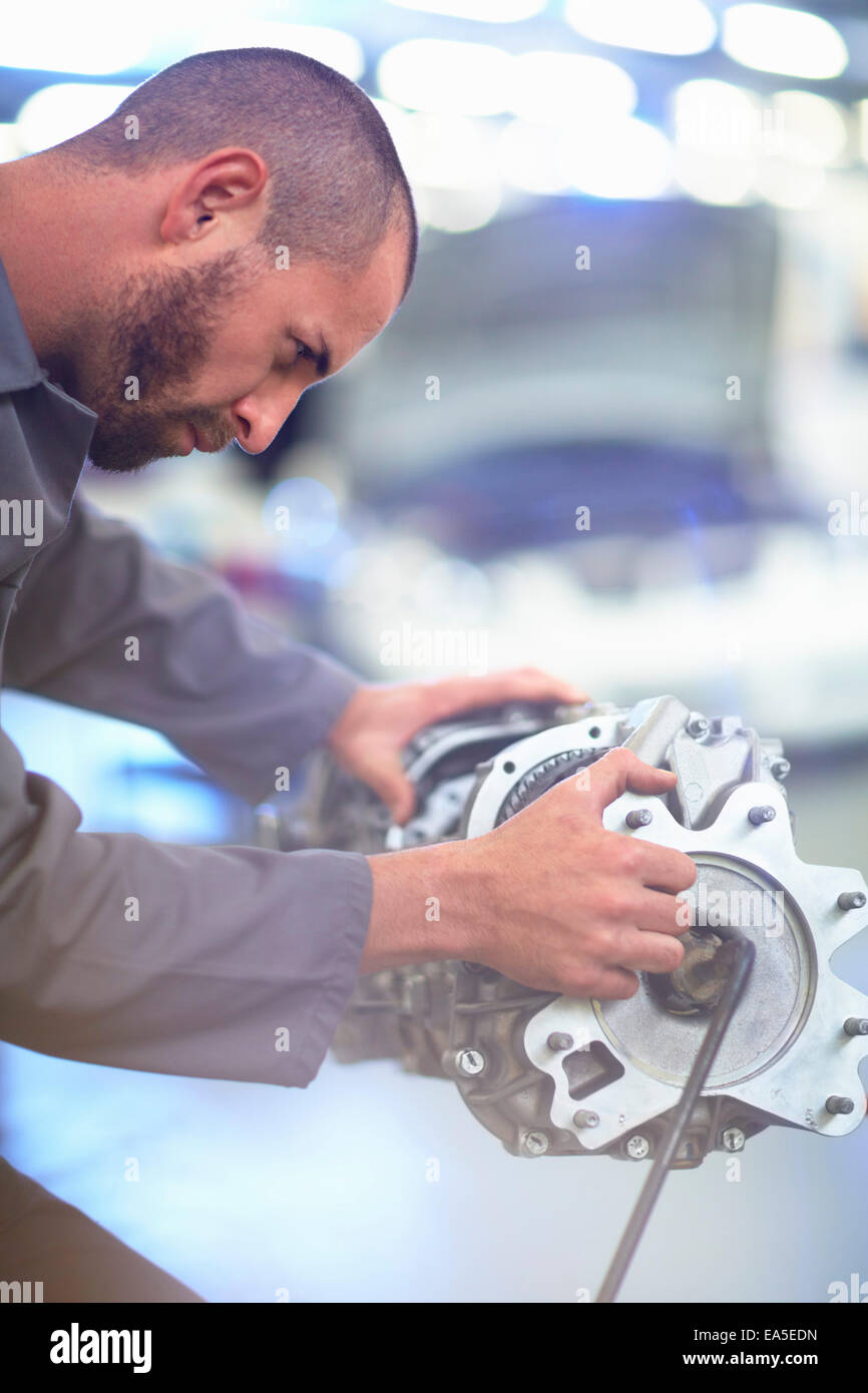 Mechanic in garage repairing gearbox hi-res stock photography and ...