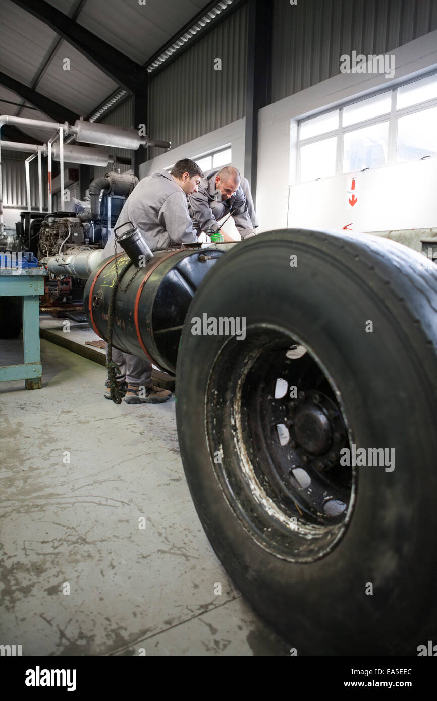 Two diesel mechanics at work Stock Photo - Alamy