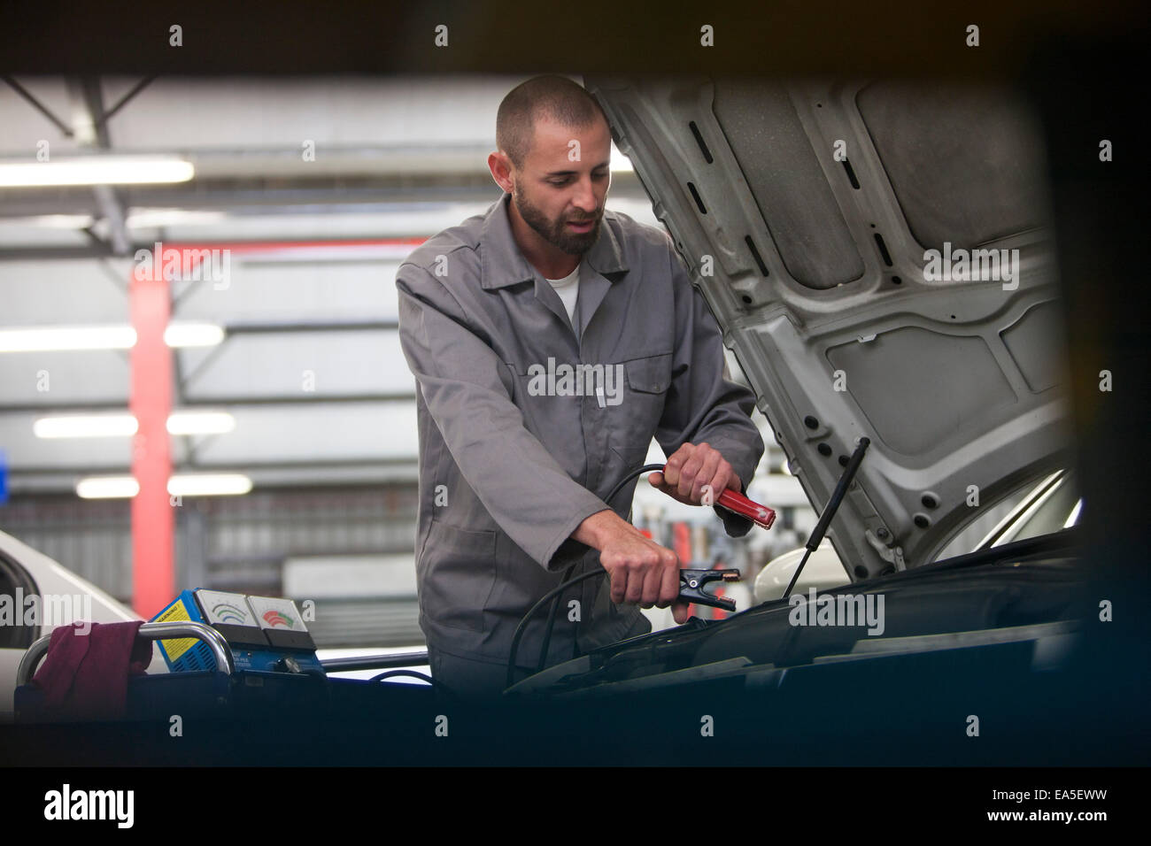 Car mechanic at work in repair garage Stock Photo - Alamy