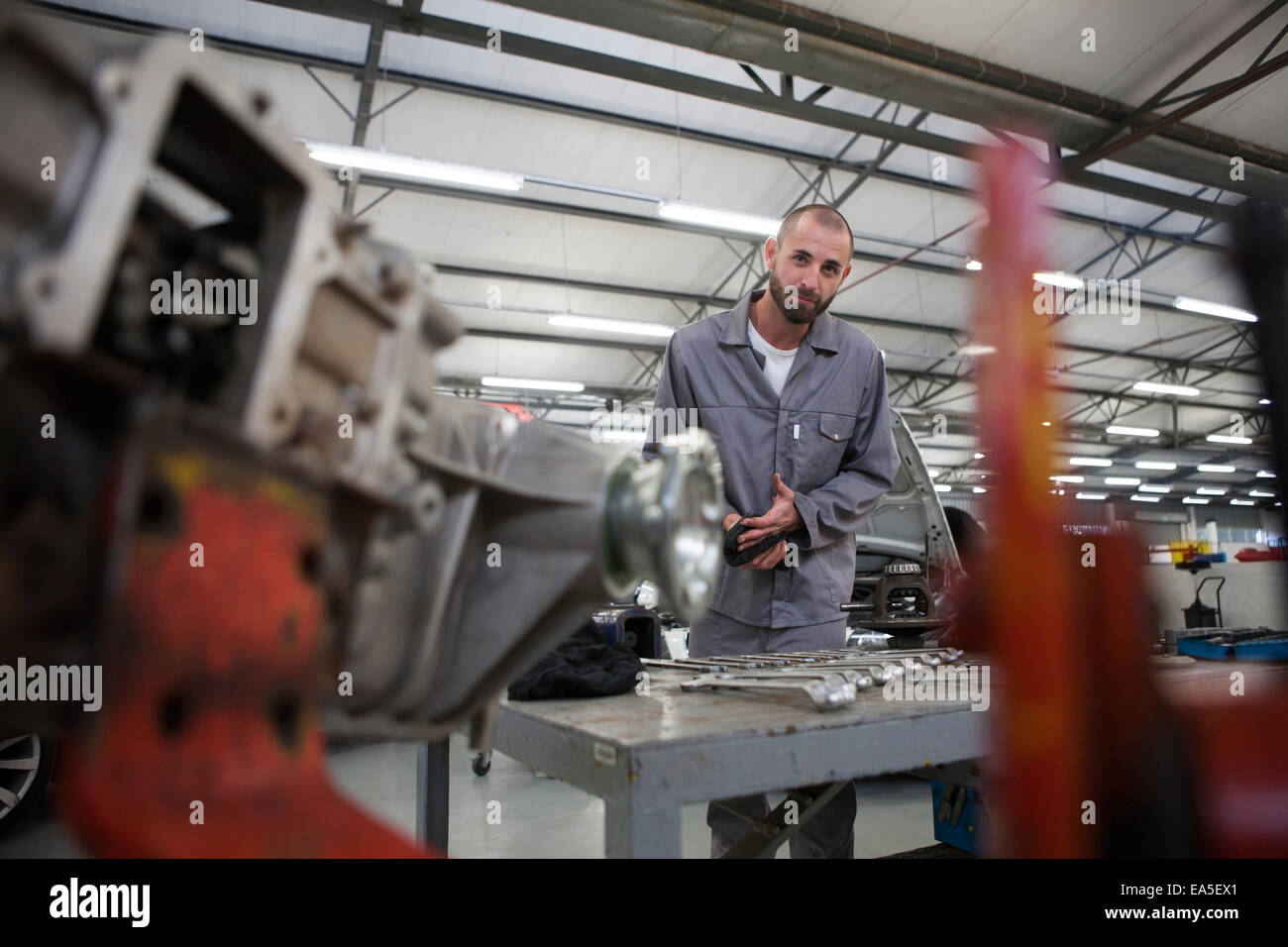 Car mechanic at work in repair garage Stock Photo - Alamy