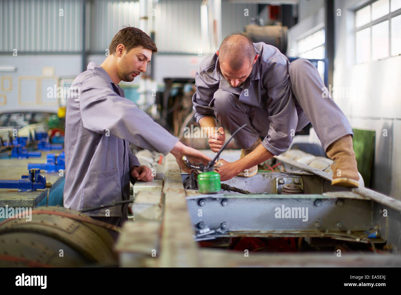 Two diesel mechanics at work Stock Photo - Alamy