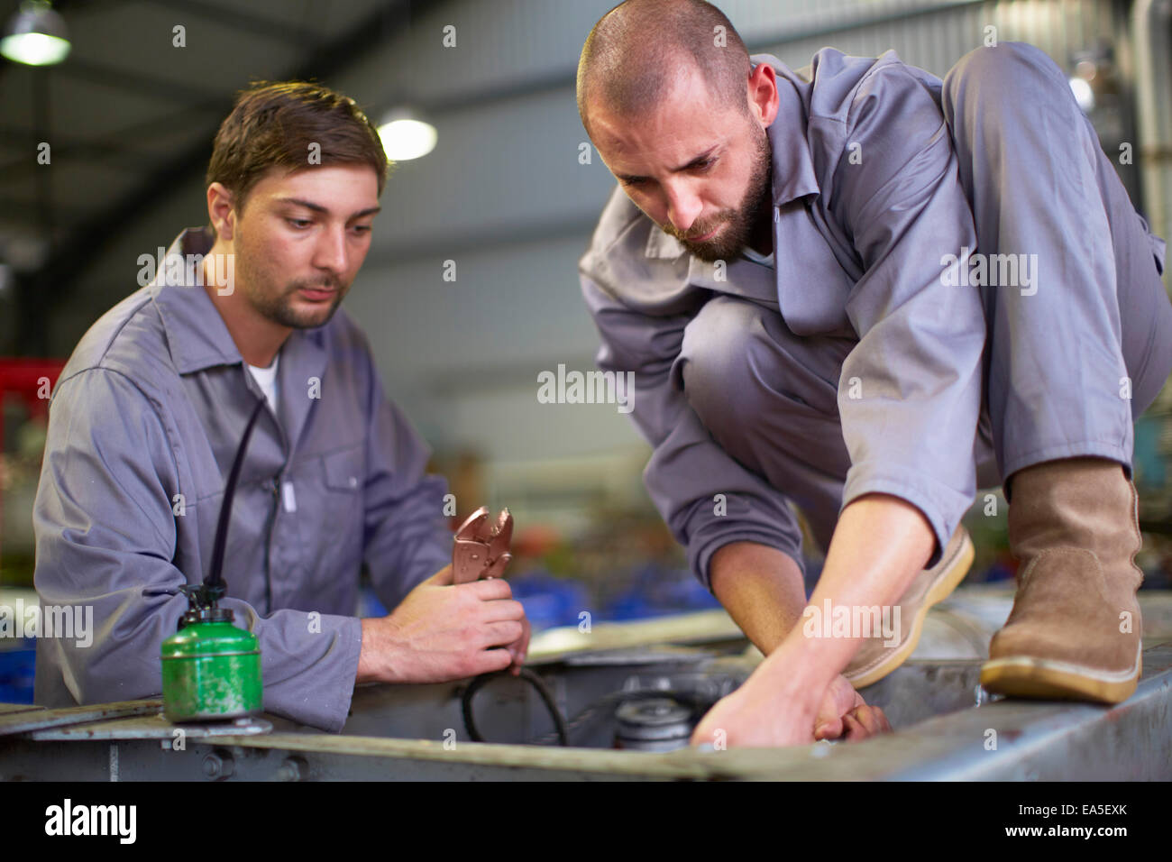 Two diesel mechanics at work Stock Photo - Alamy