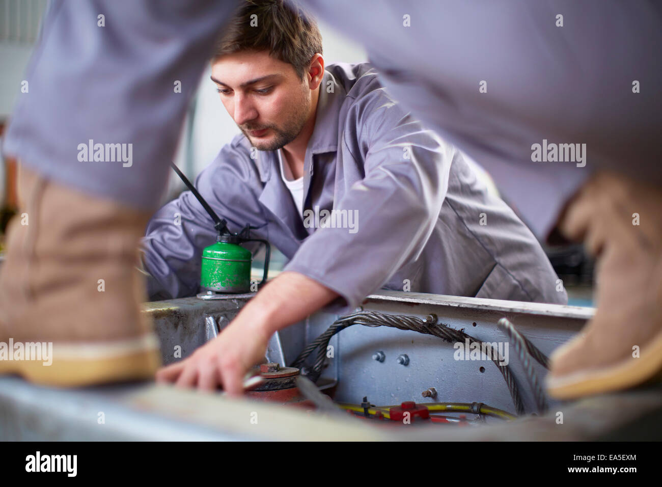 Two diesel mechanics at work Stock Photo - Alamy