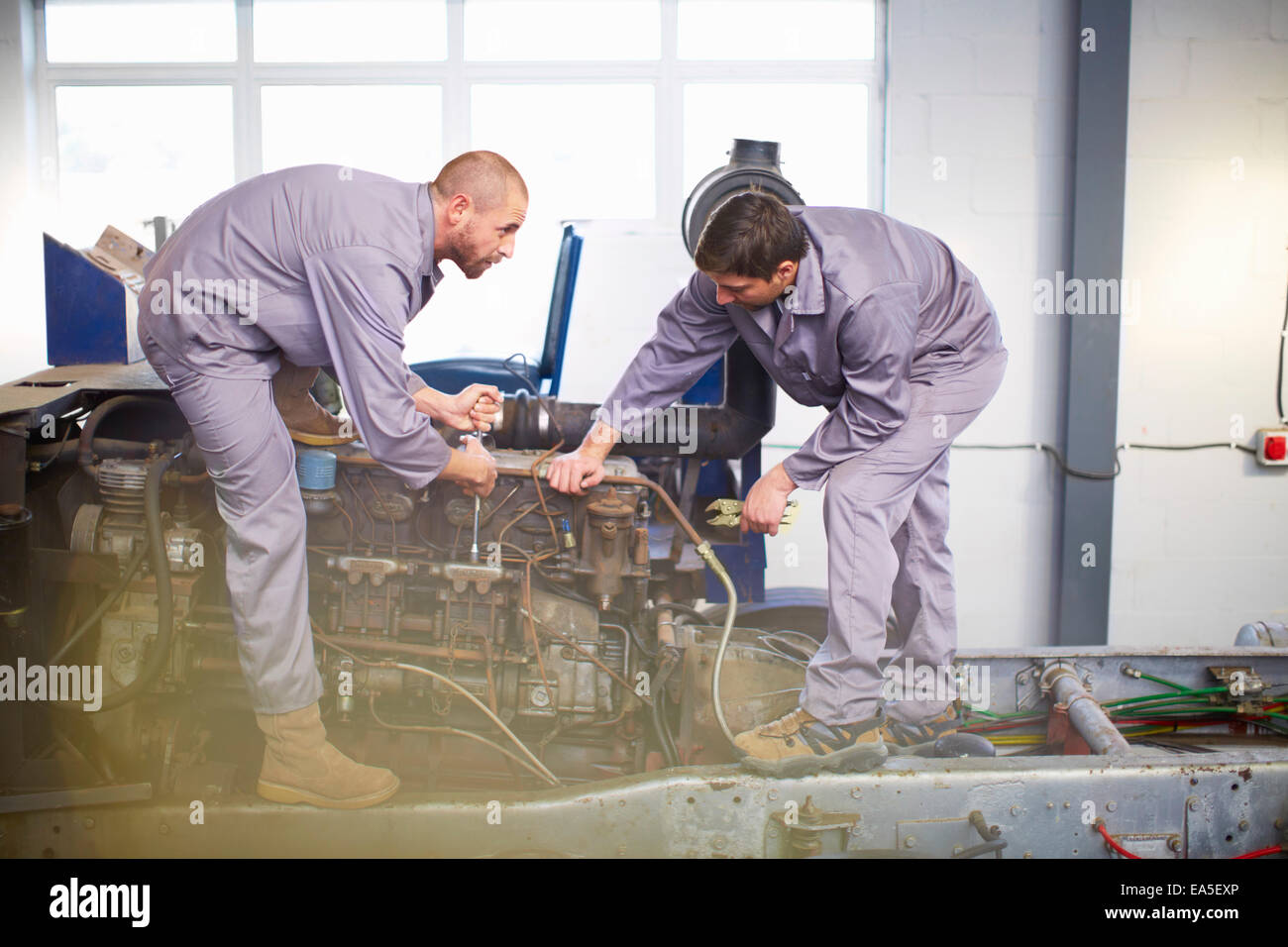 Two diesel mechanics at work Stock Photo - Alamy