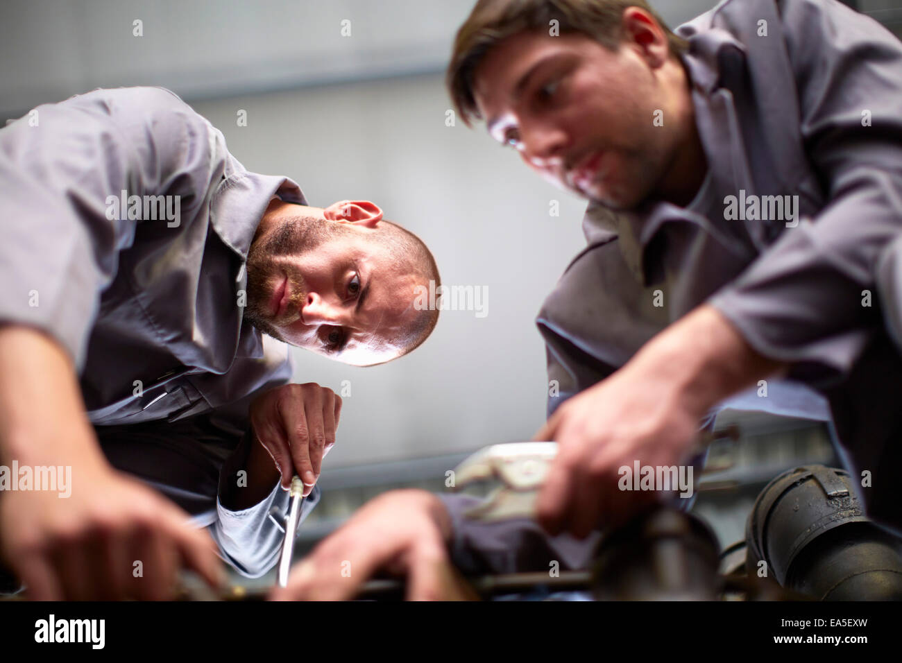 Two diesel mechanics at work Stock Photo - Alamy