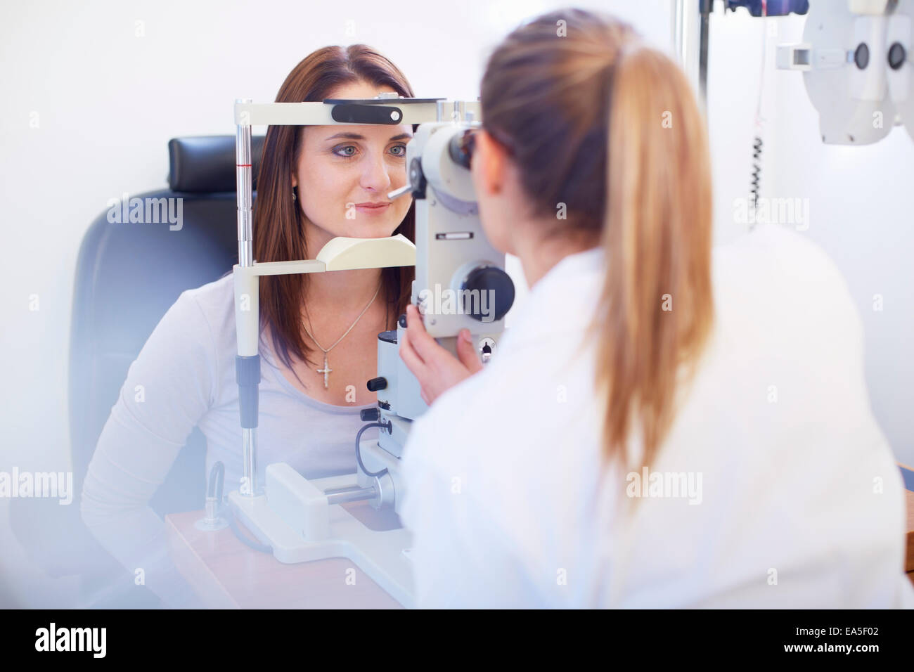 Doctor examining womans face hi-res stock photography and images - Alamy