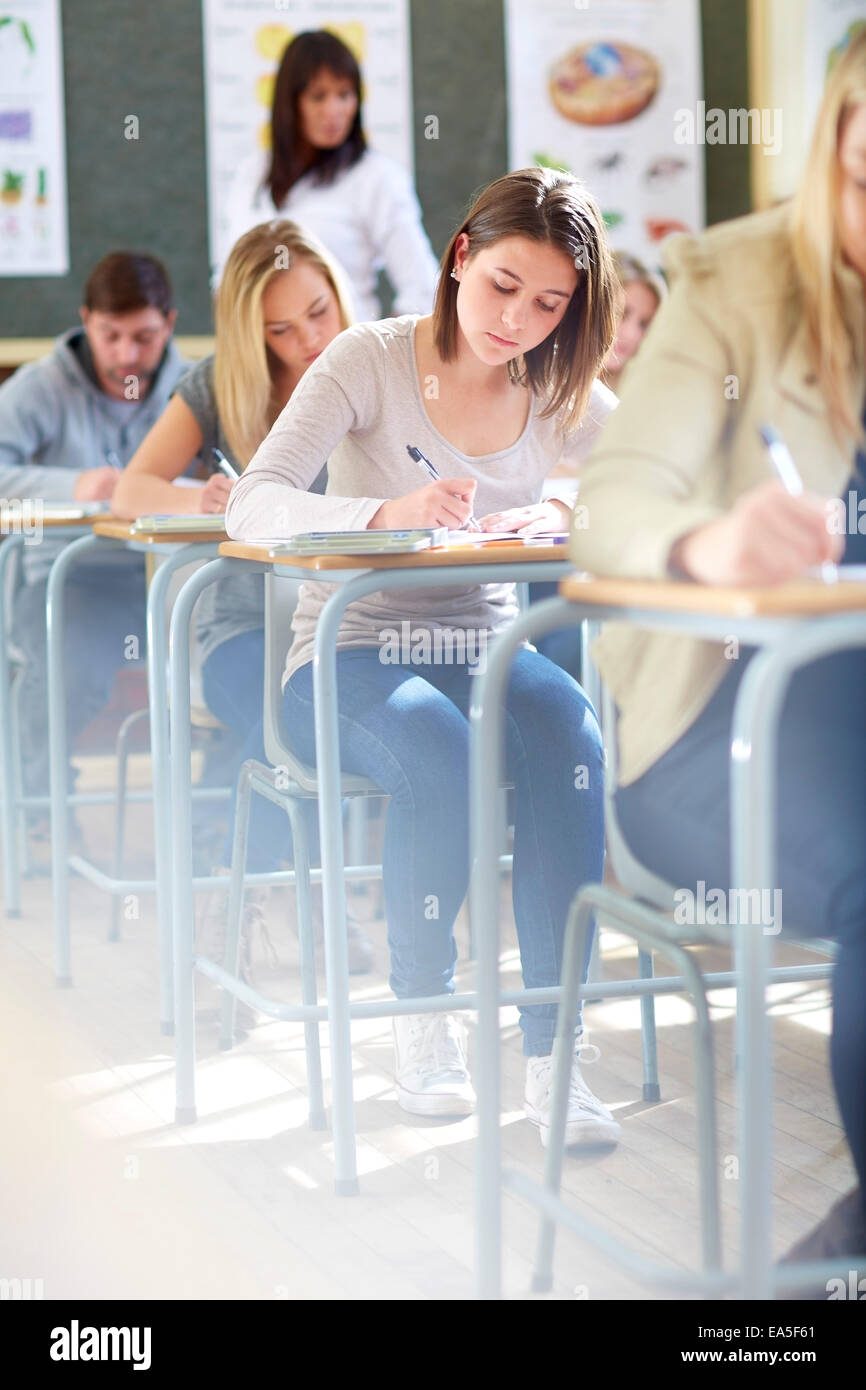 Students in classroom having an exam Stock Photo - Alamy