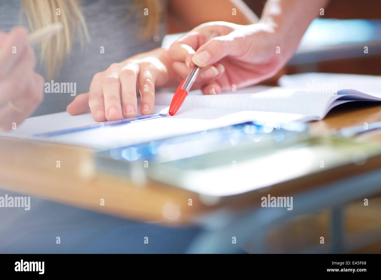 Teacher explaining something to student in classroom Stock Photo - Alamy Teacher explaining something to student in classroom Stock Photo - Alamy