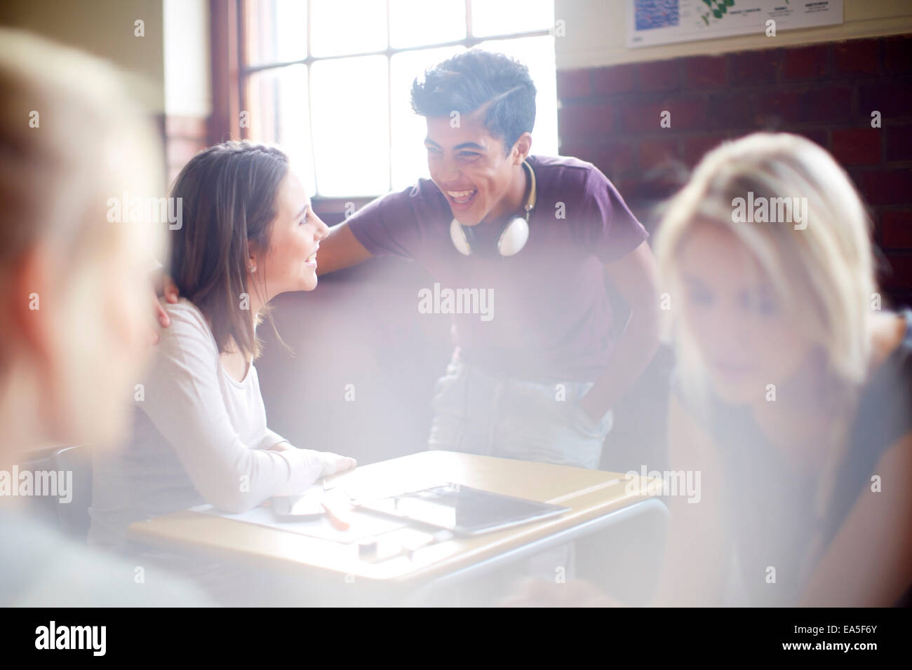 Students talking in classroom Stock Photo - Alamy