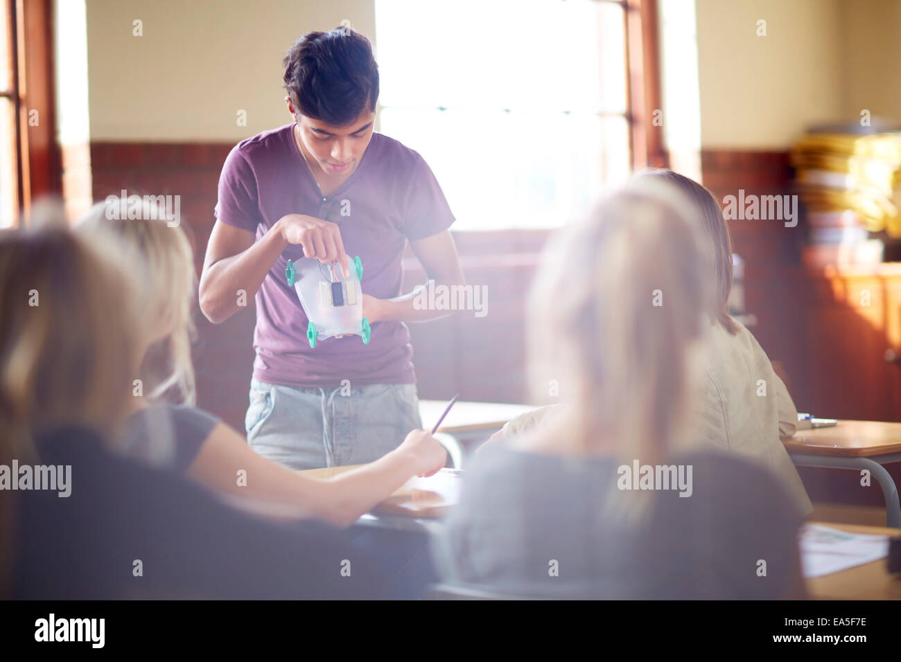 Student holding a presentation in classroom Stock Photo - Alamy