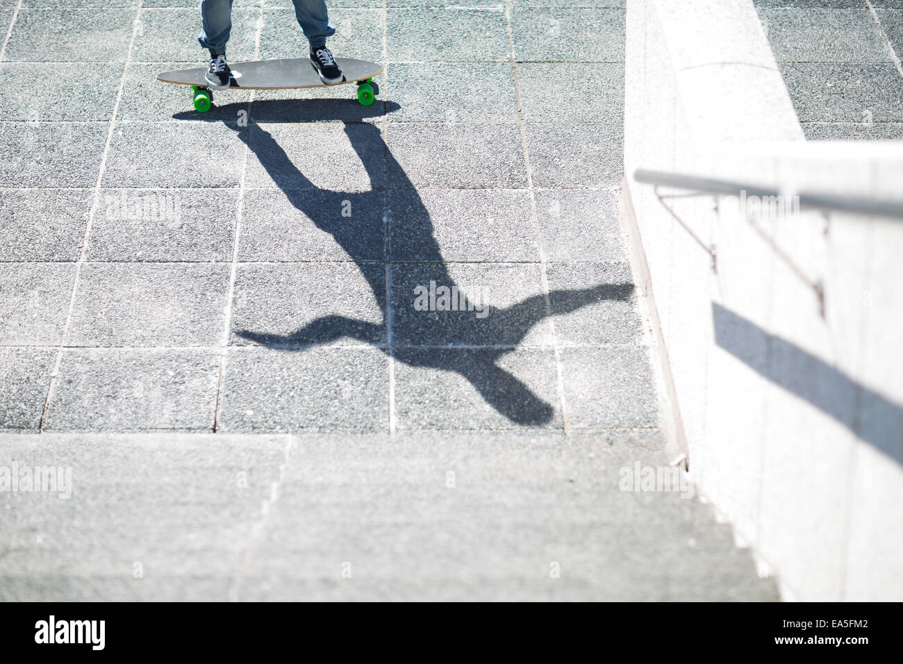 Shadow of a skate boarder on pavement Stock Photo - Alamy