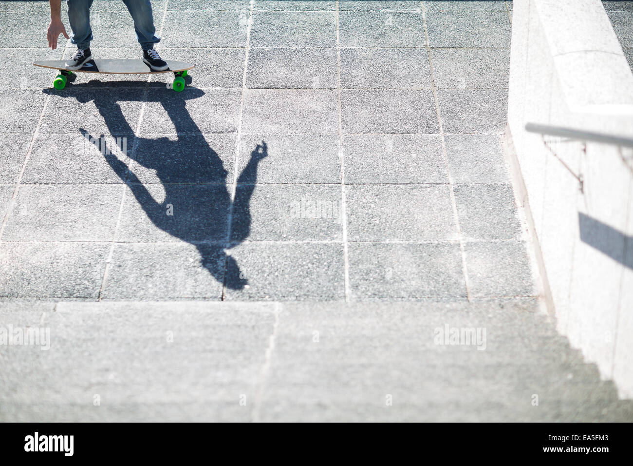 Shadow of a skate boarder on pavement Stock Photo - Alamy