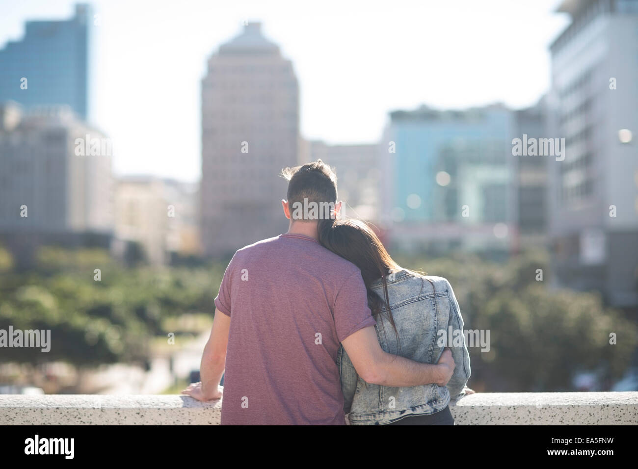 Young couple in love, back view Stock Photo - Alamy