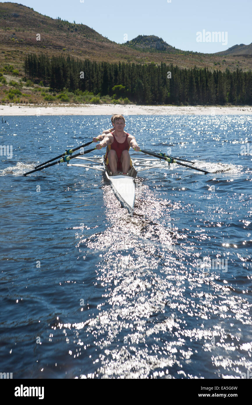 Coxless four rowing boat in water Stock Photo - Alamy