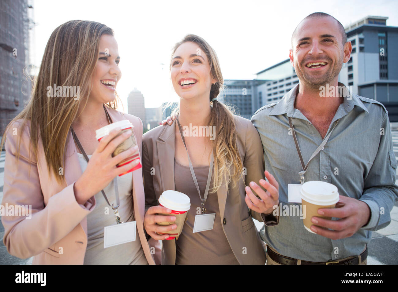 Three colleagues having fun at break time Stock Photo - Alamy