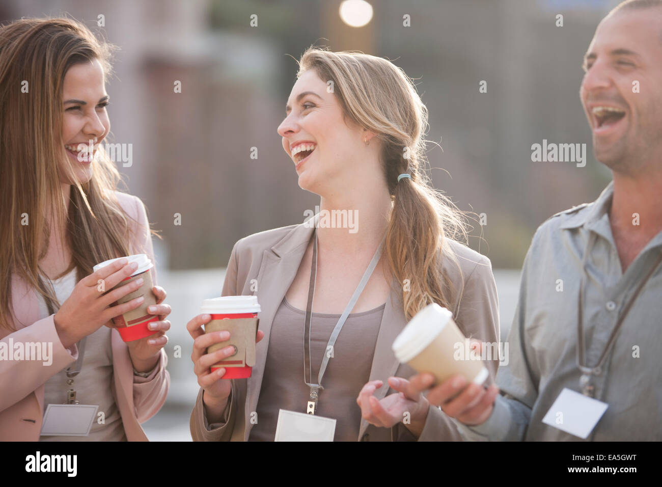 Three colleagues having fun at break time Stock Photo - Alamy