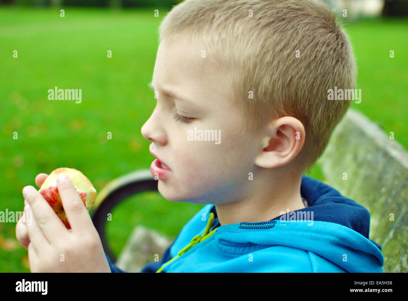 Small Boy Eating An Apple High Resolution Stock Photography and Images ...