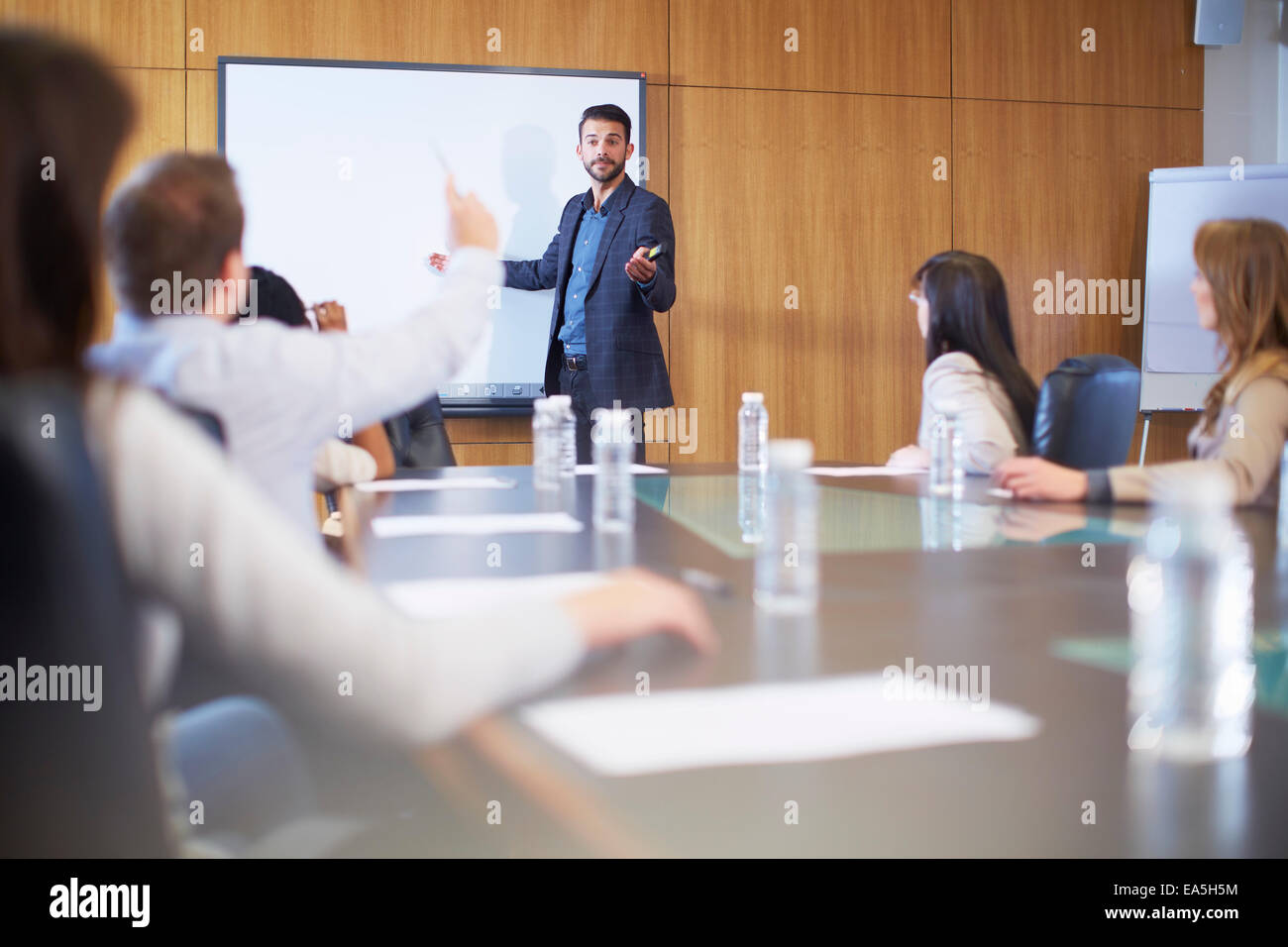 Manager leading business meeting in boardroom Stock Photo - Alamy