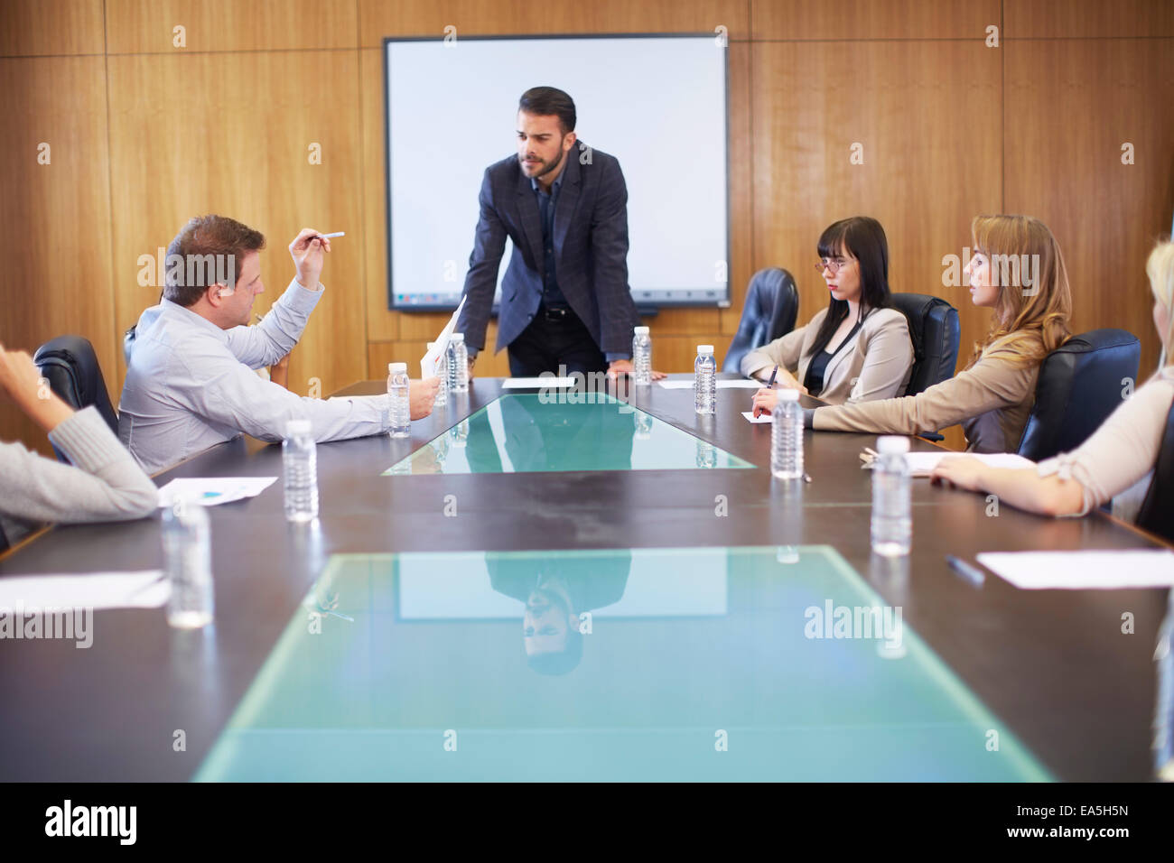 Manager leading business meeting in boardroom Stock Photo - Alamy