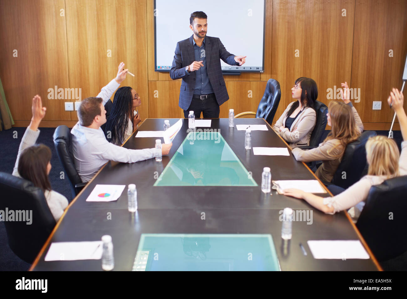 Manager leading business meeting in boardroom Stock Photo - Alamy