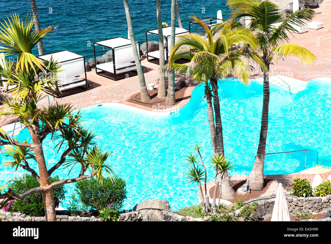 Swimming pool at luxury resort Stock Photo - Alamy