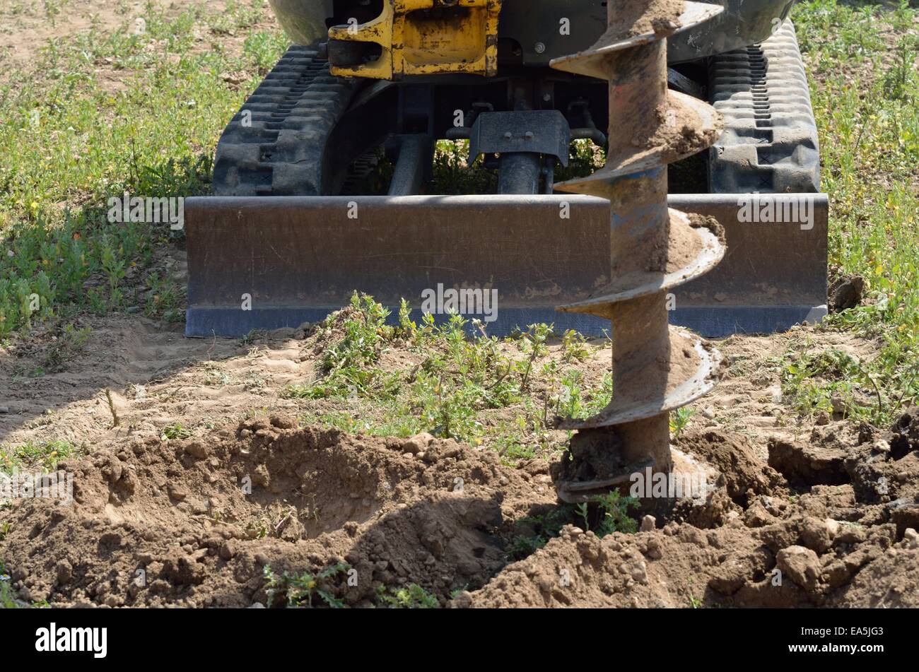 digger with construction drill Stock Photo - Alamy