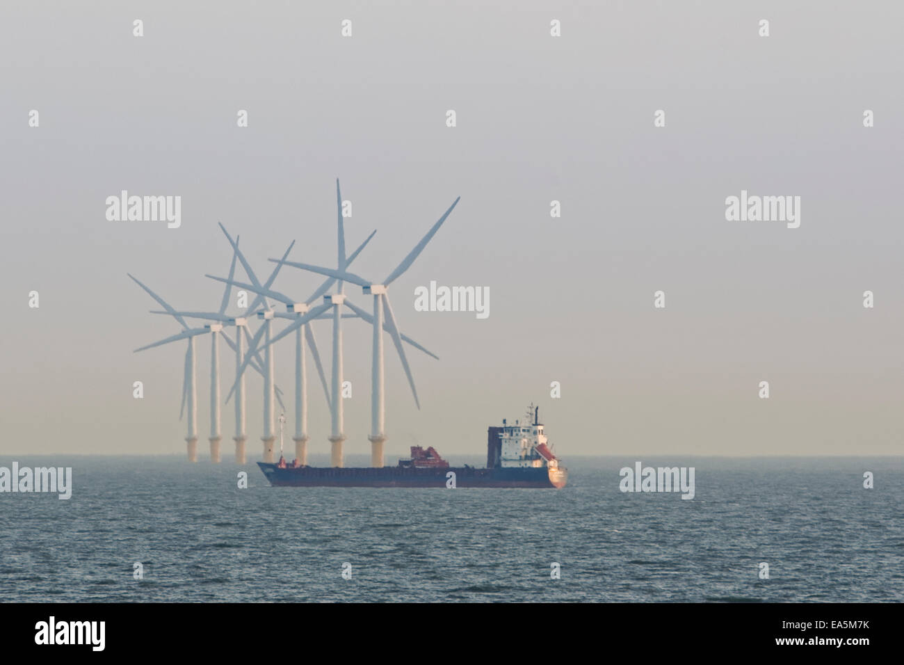 Offshore wind farm turbines and barge in sea near Clacton-on-Sea, Essex ...