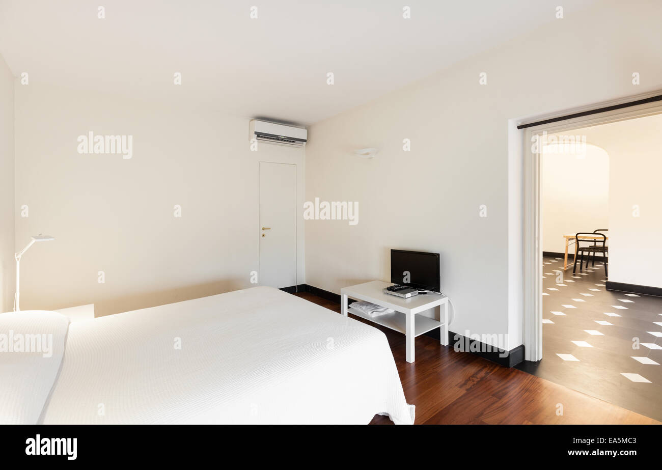 Interior house, white bedroom, double bed Stock Photo - Alamy