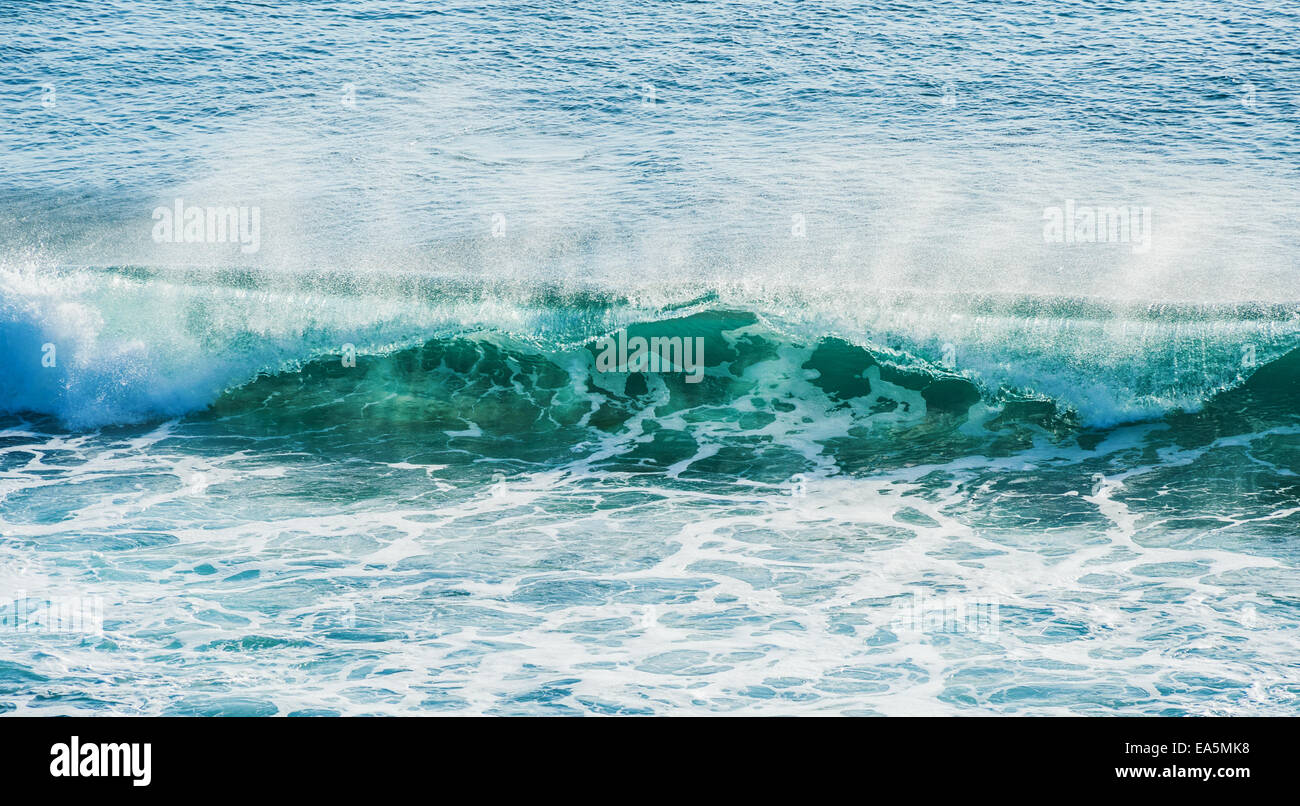 swirled blue colored ocean wave Stock Photo - Alamy
