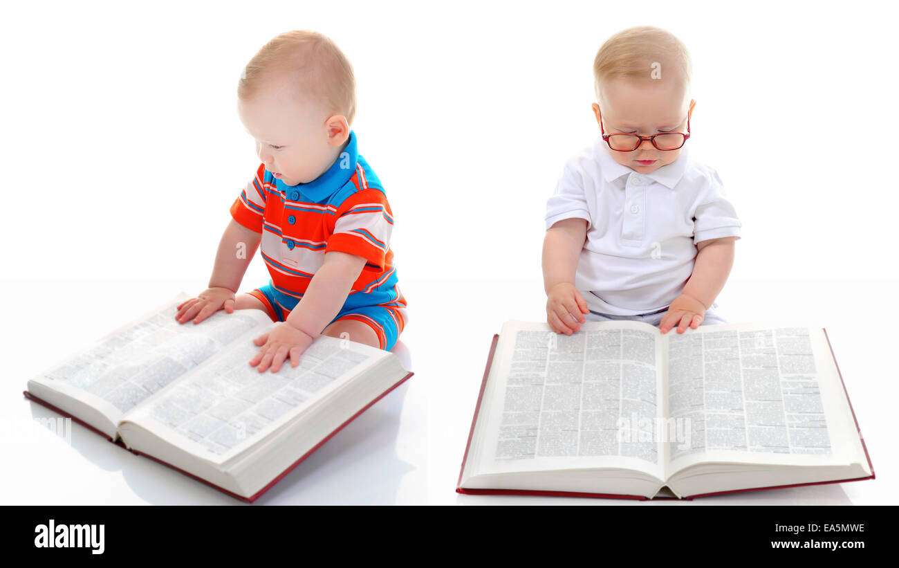 Little smart boy reads a big book Stock Photo - Alamy