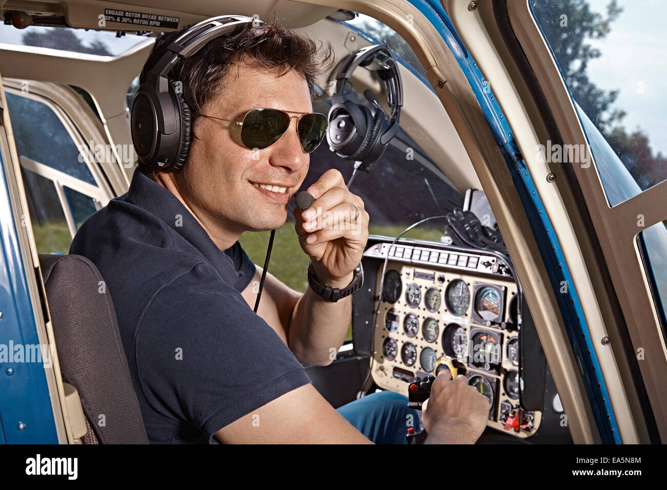 Germany, Bavaria, Landshut, Helicopter pilot in cockpit Stock Photo - Alamy