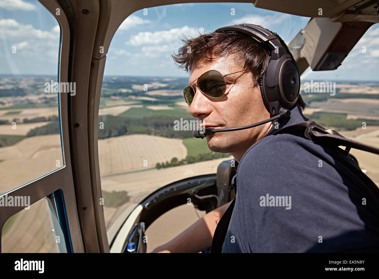 Germany, Bavaria, Landshut, Helicopter pilot in cockpit Stock Photo - Alamy