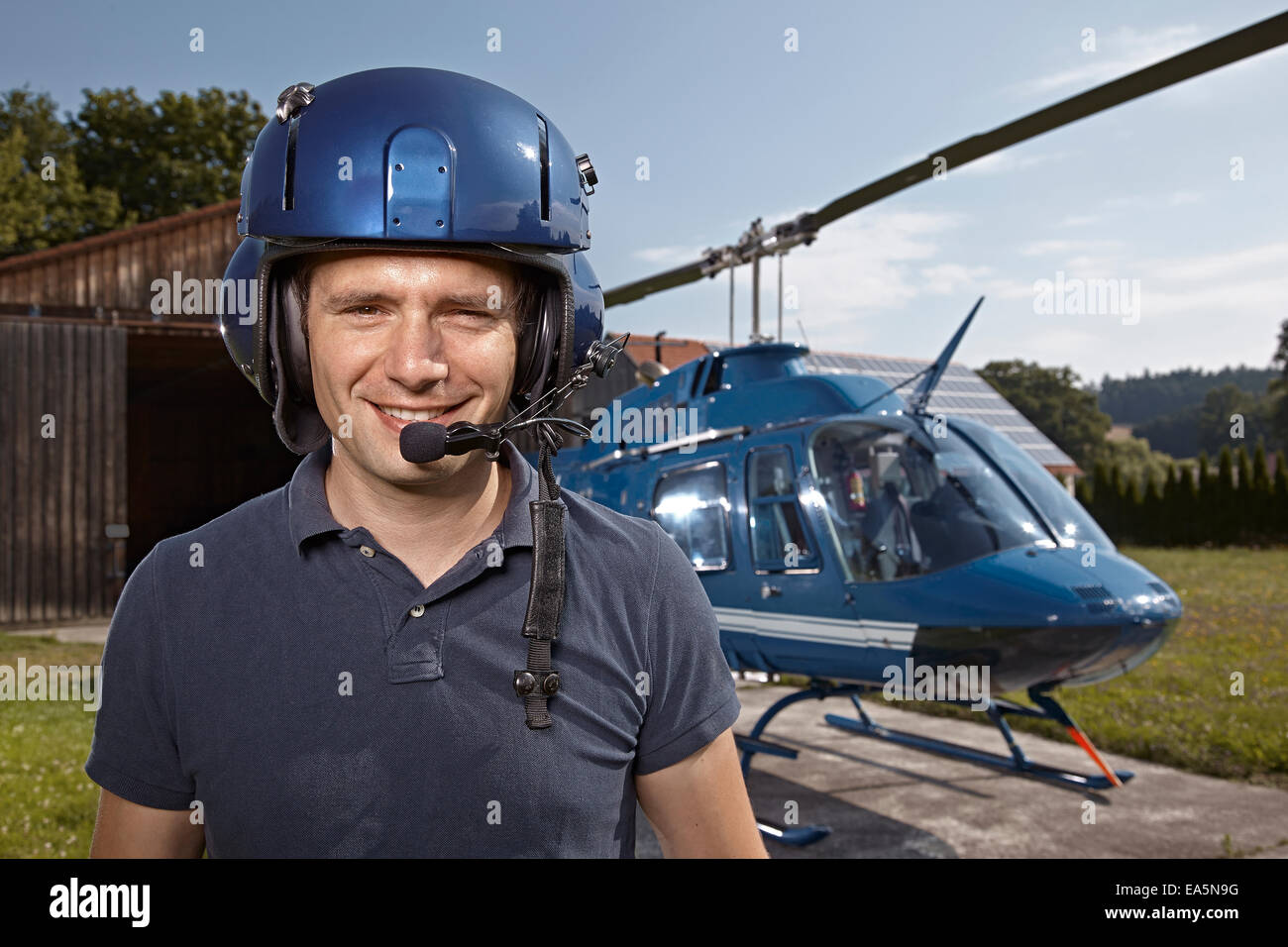 Germany, Bavaria, Landshut, Helicopter pilot wearing helmet Stock Photo ...