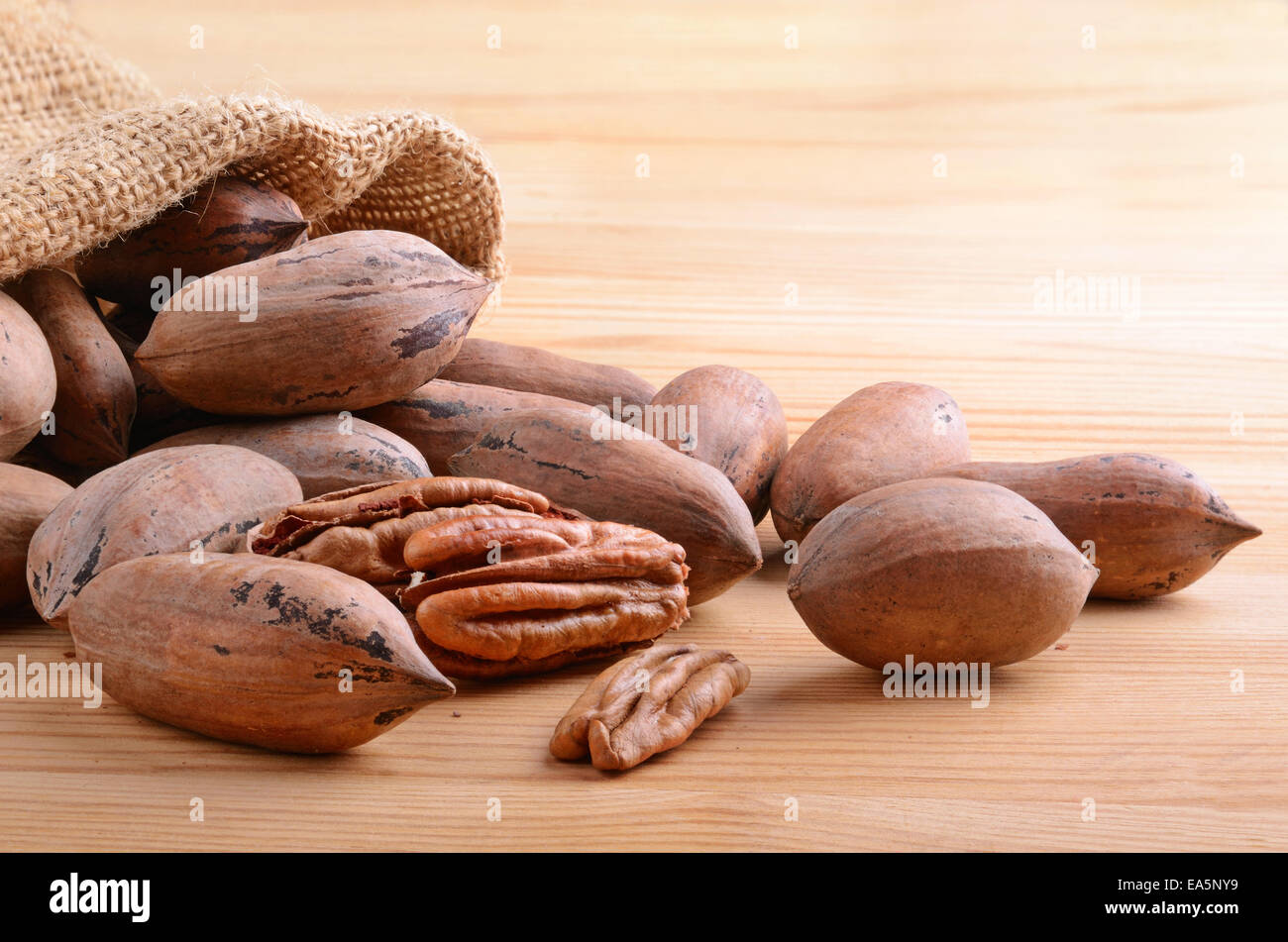 Nuts on wooden background Stock Photo - Alamy