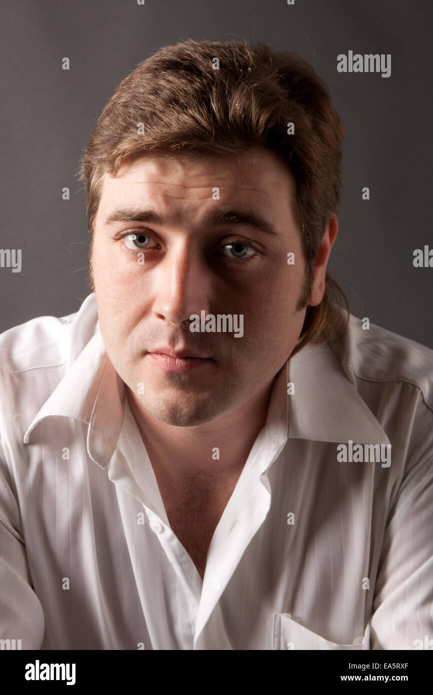 man posing in white shirt Stock Photo - Alamy