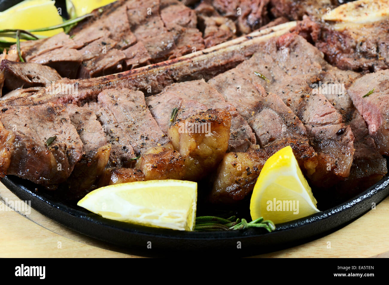 Stake from mutton with a lemon Stock Photo - Alamy