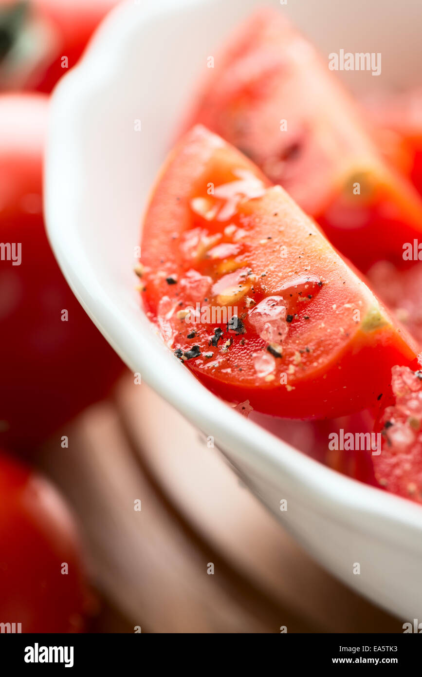 Tomato salad in plate with rock salt Stock Photo - Alamy