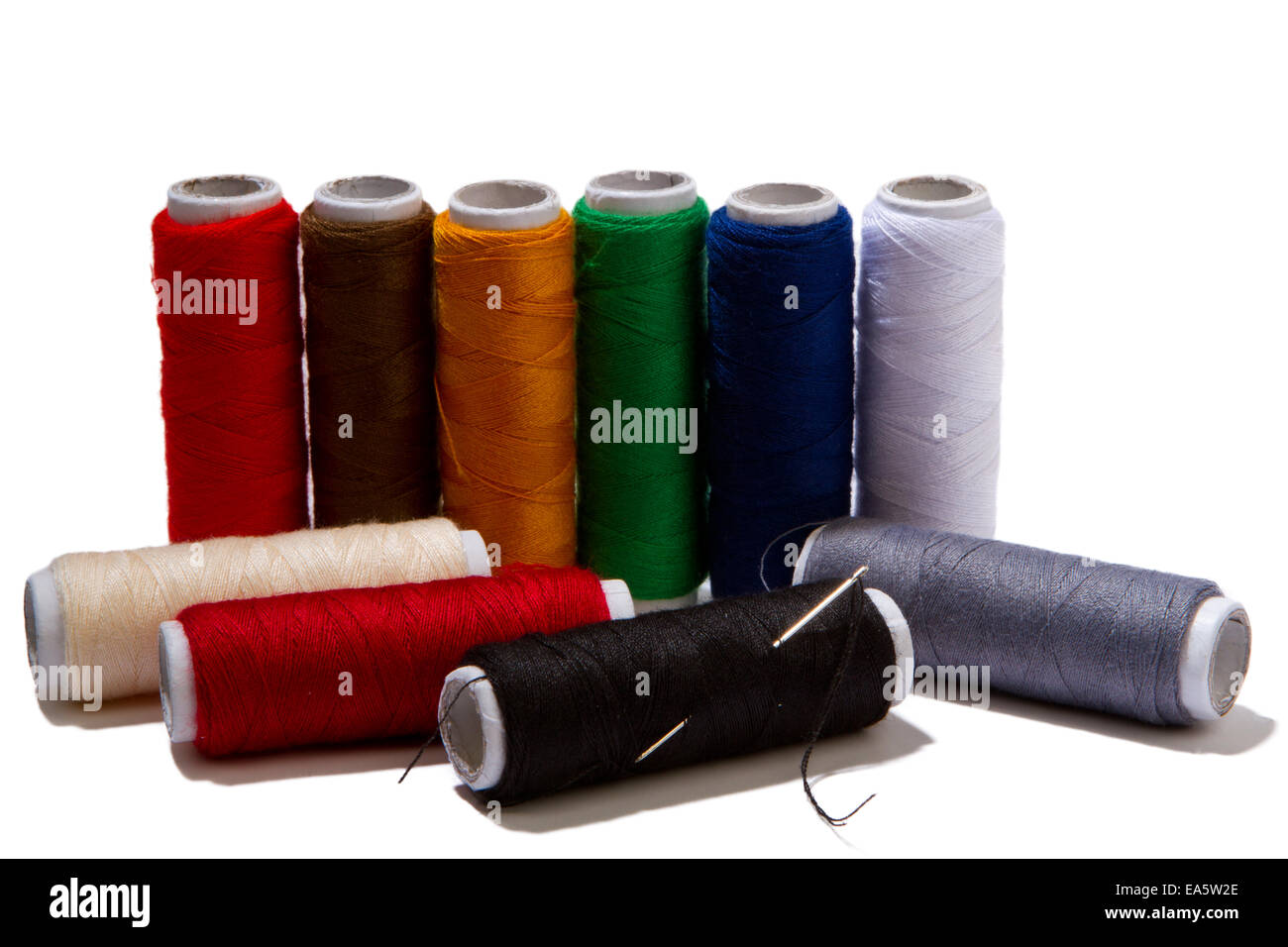 Spools thread sewing clothes Cut Out Stock Images & Pictures - Alamy