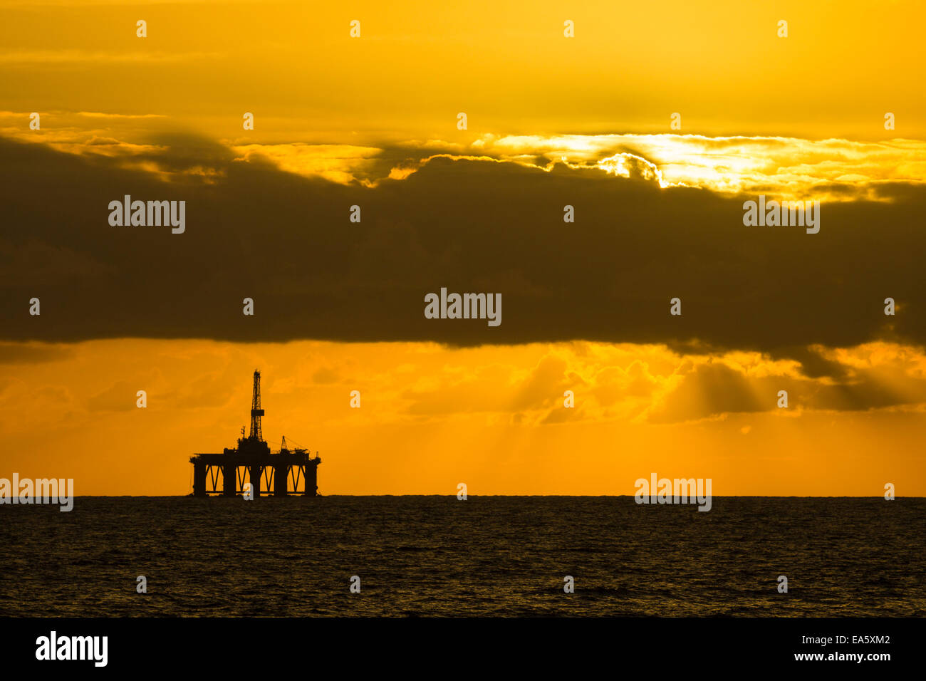Offshore Oil rig at sunrise Stock Photo - Alamy