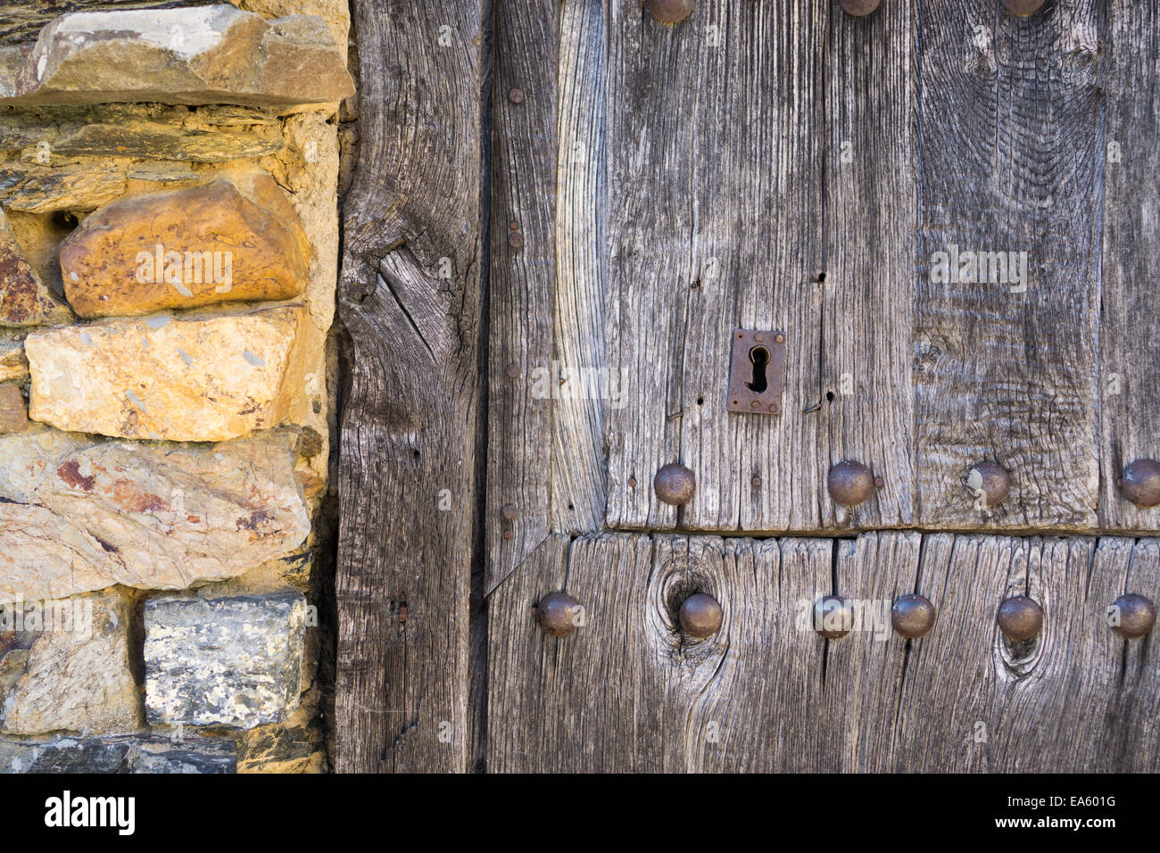Front view of old lock and wooden door with iron nails Stock Photo - Alamy
