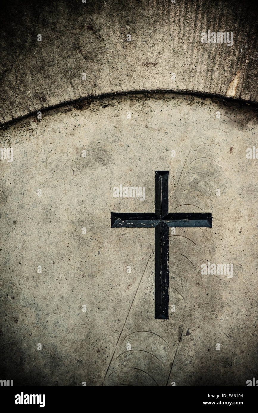 Close up of old tombstone with cross in graveyard, Sweden Stock Photo ...