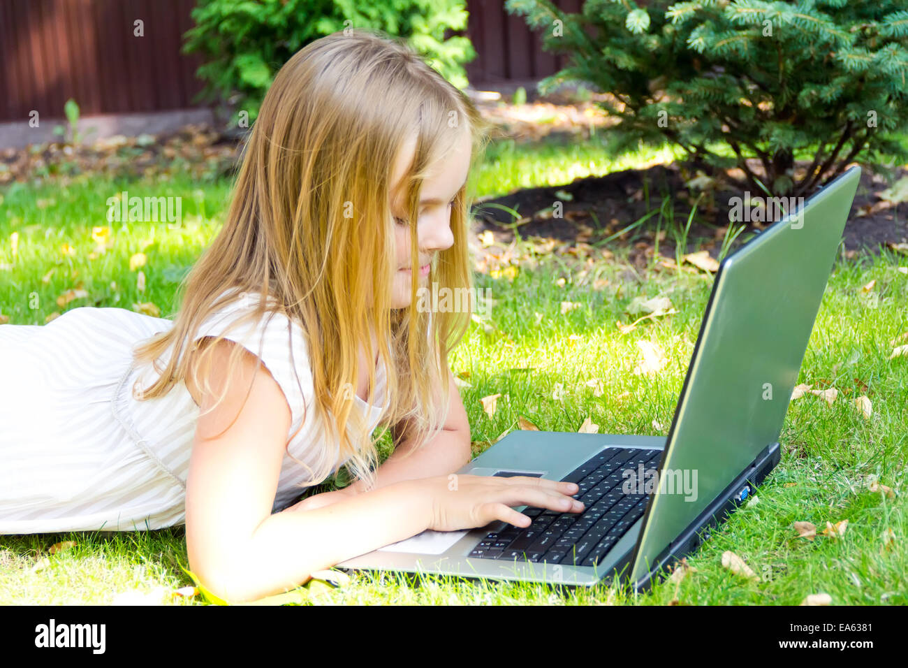 Cute girl with laptop Stock Photo - Alamy