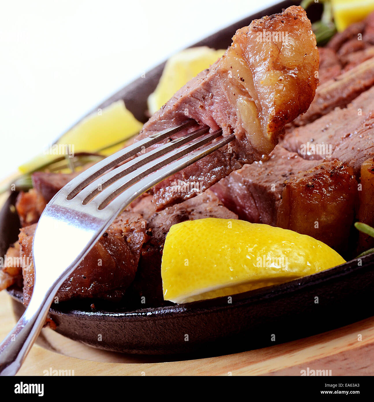 Stake from mutton with a lemon Stock Photo - Alamy
