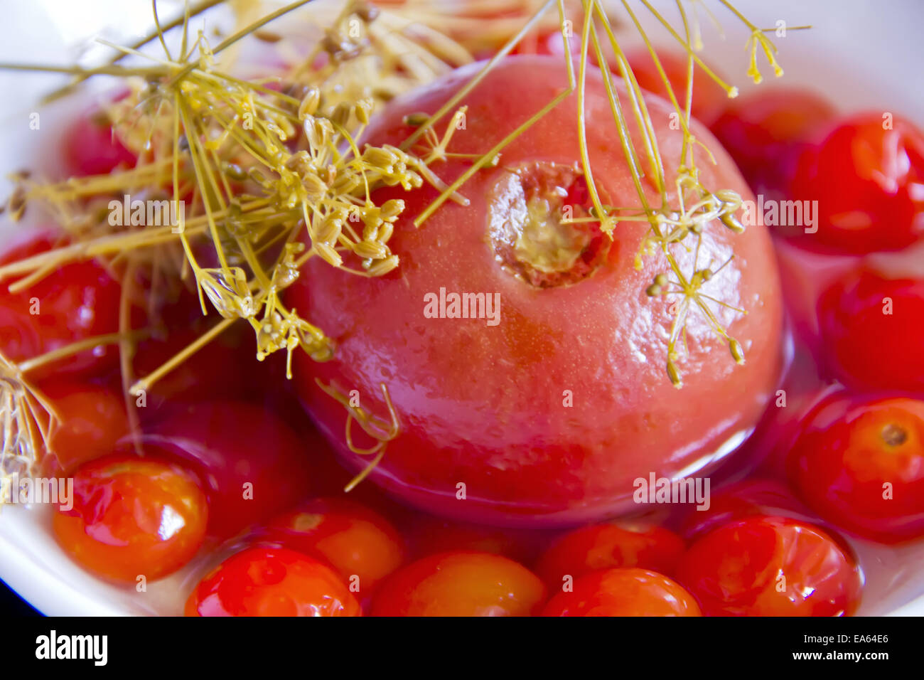 Red tomato in brine Stock Photo - Alamy
