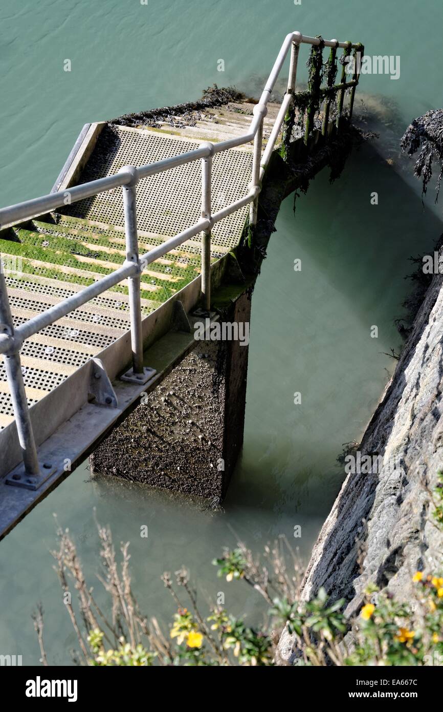 Looking down steps leading to the seawater beside the sea wall not ...