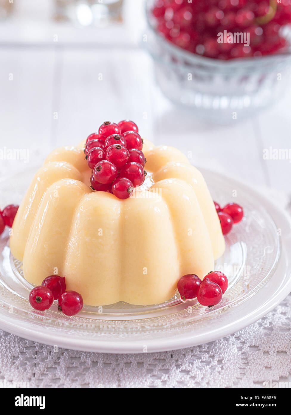 Vanilla pudding with red currants Stock Photo - Alamy